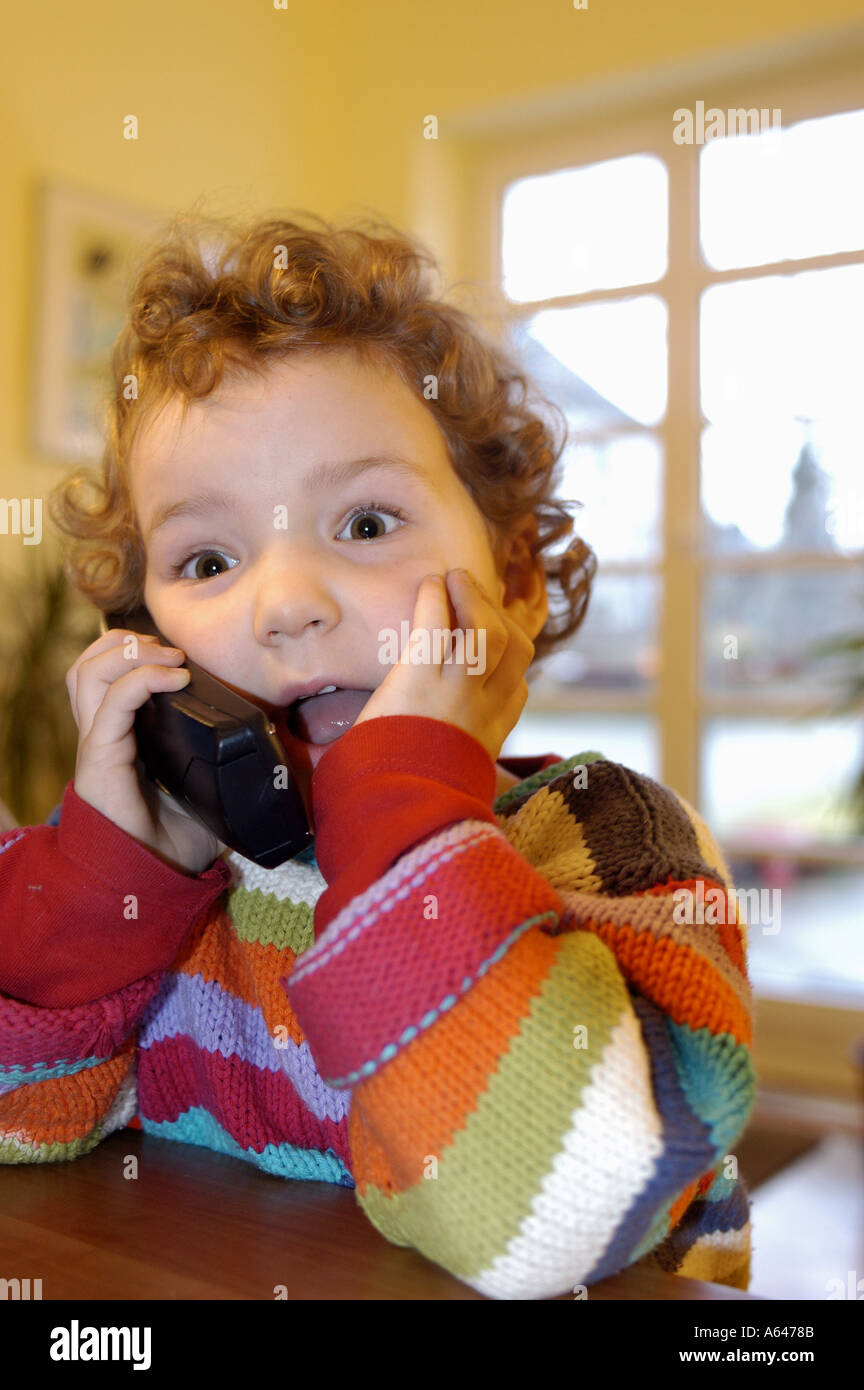 Little Girl calling with a cellular telephone Stock Photo - Alamy