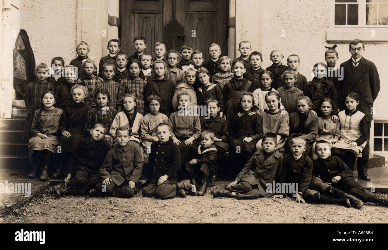 Historical picture schoolclass in the year 1900 boys and girls with ...