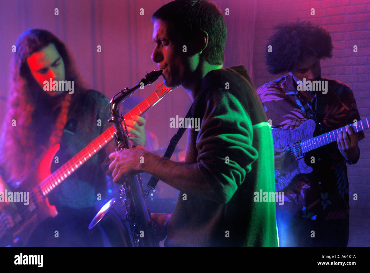 Jazz ensemble playing in night club Stock Photo - Alamy