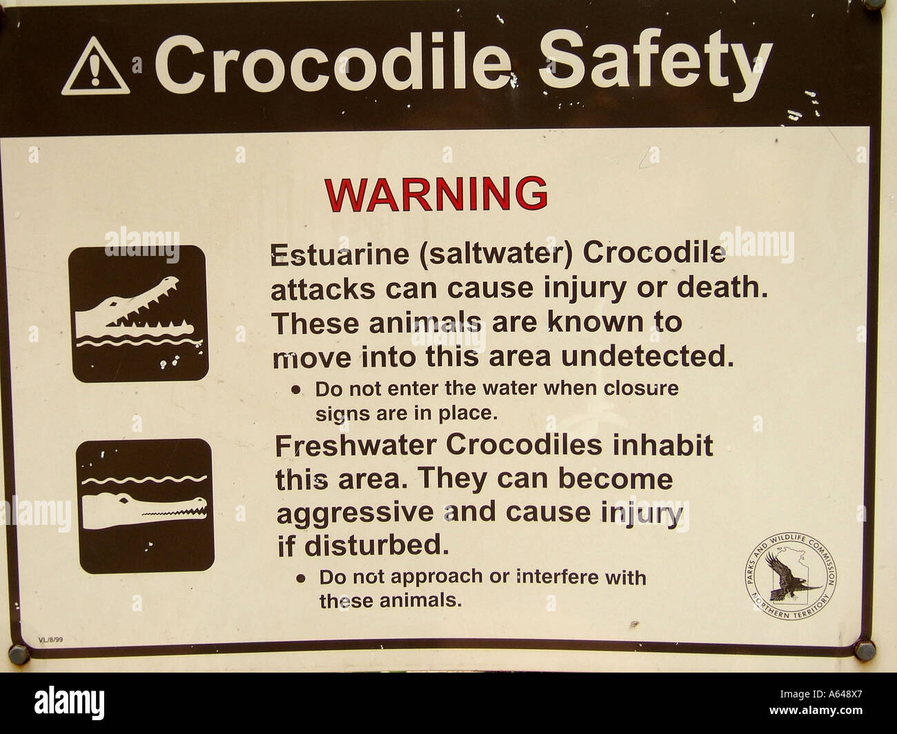 Crocodile warning sign tjaynera falls or sandy creek hi-res stock ...
