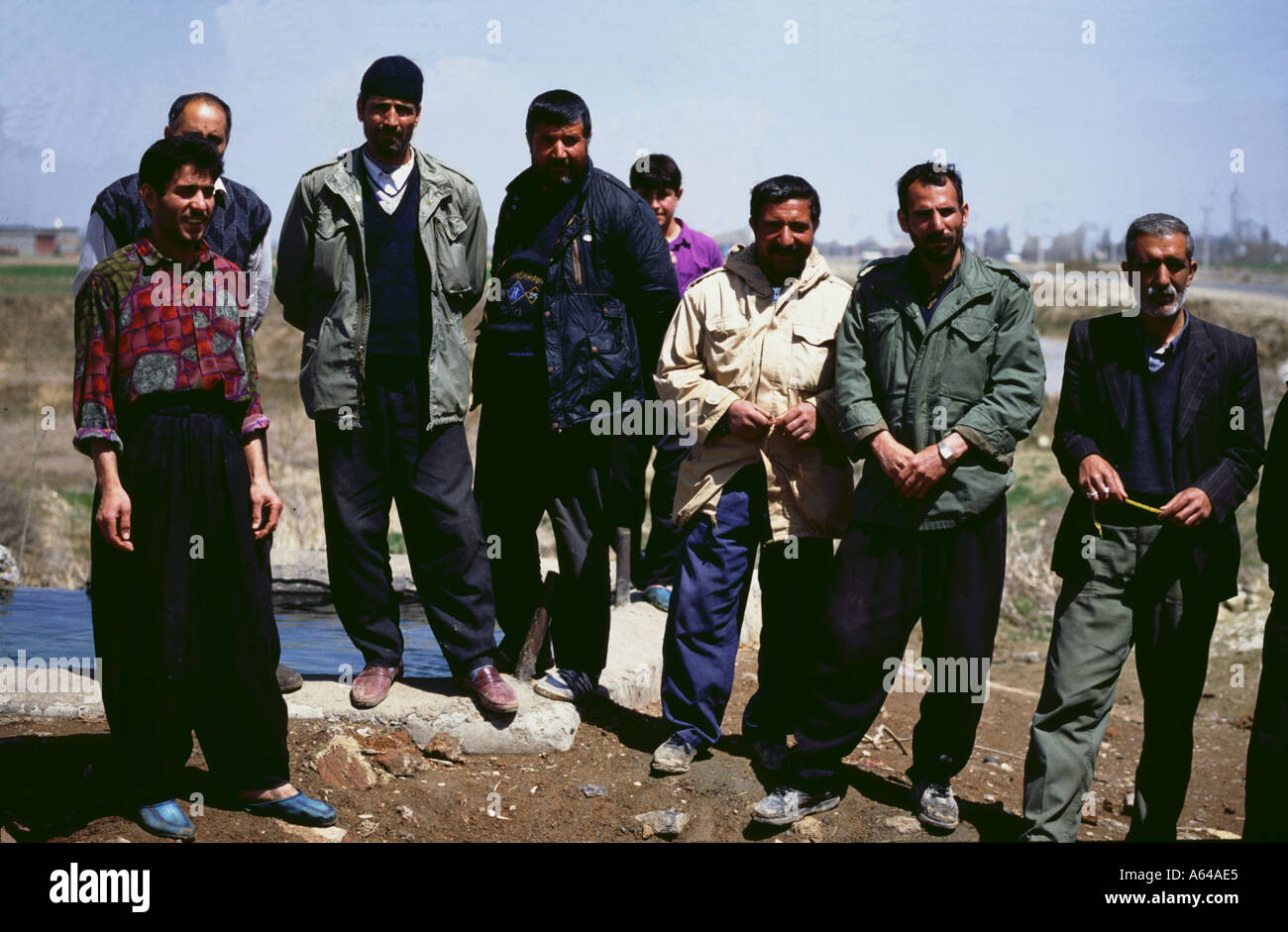 Iran men man people standing curious looking group lot of typically ...