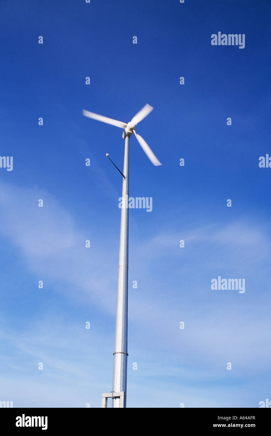 Small Wind Turbine in Motion in Bourne, Cape Cod USA on a clear blue ...