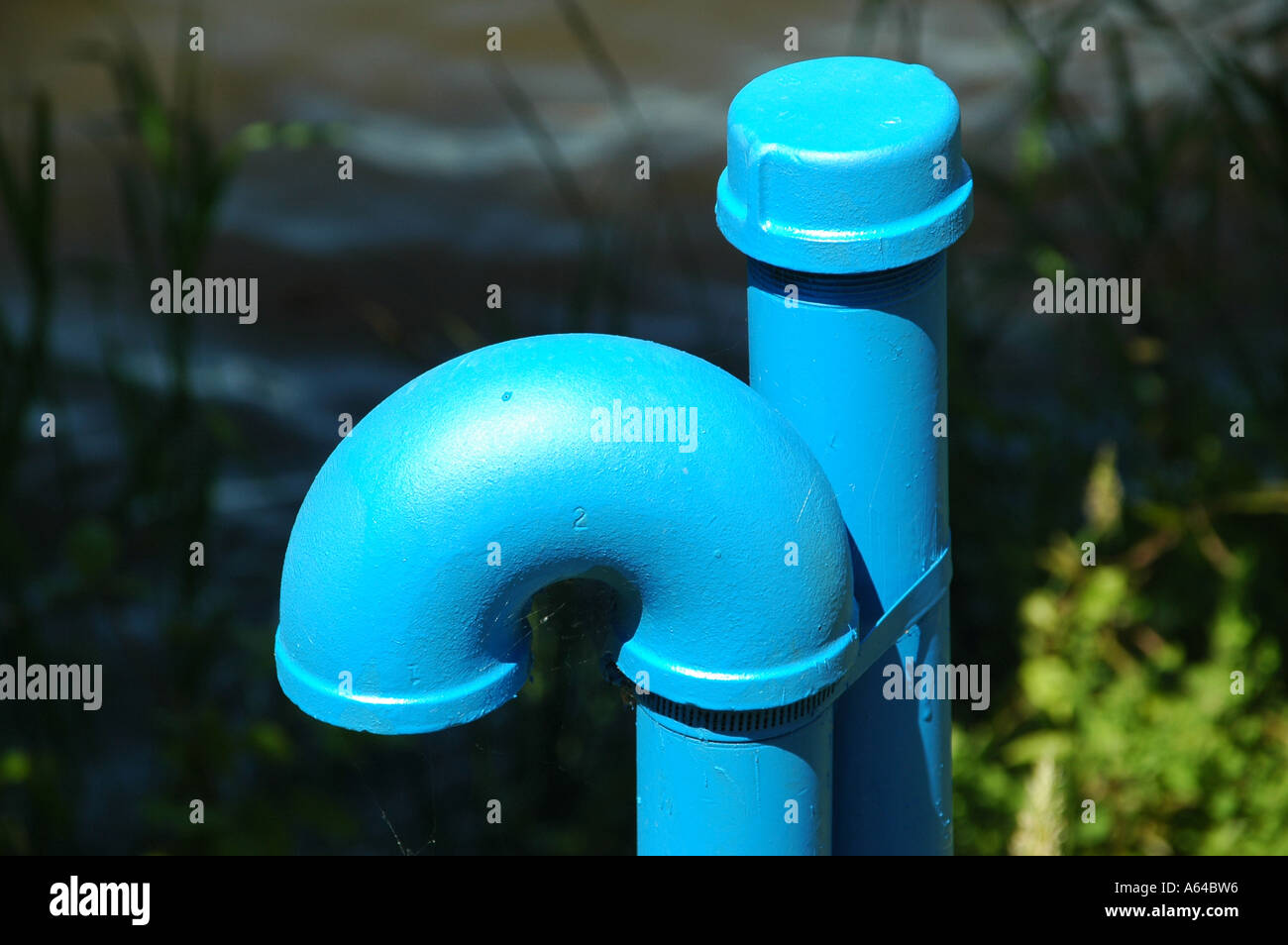 Blue stand pipes Stock Photo - Alamy