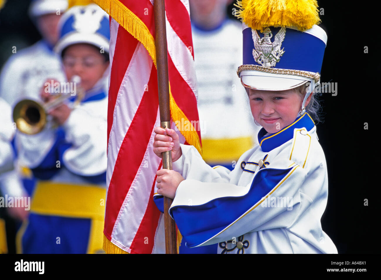Female Flag Bearer with Marching Band in Parade Stock Photo - Alamy