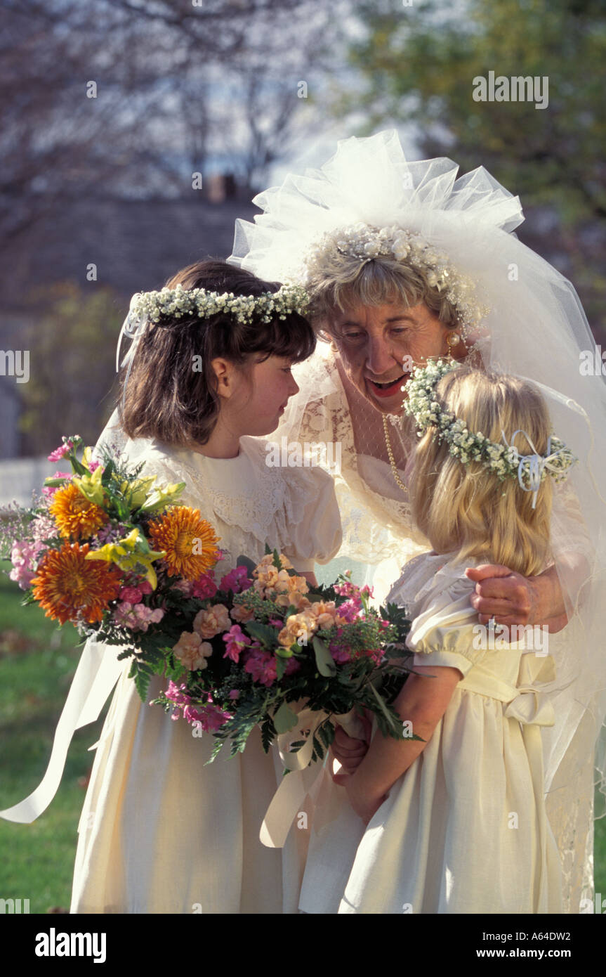 Elderly bride with flower girls Stock Photo - Alamy