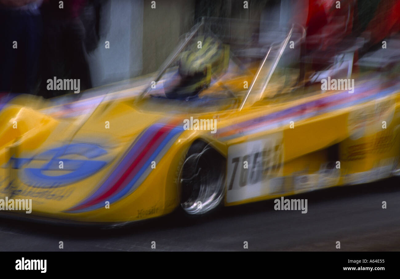 Yellow racing car with zoom effect on time trial start line Stock Photo ...