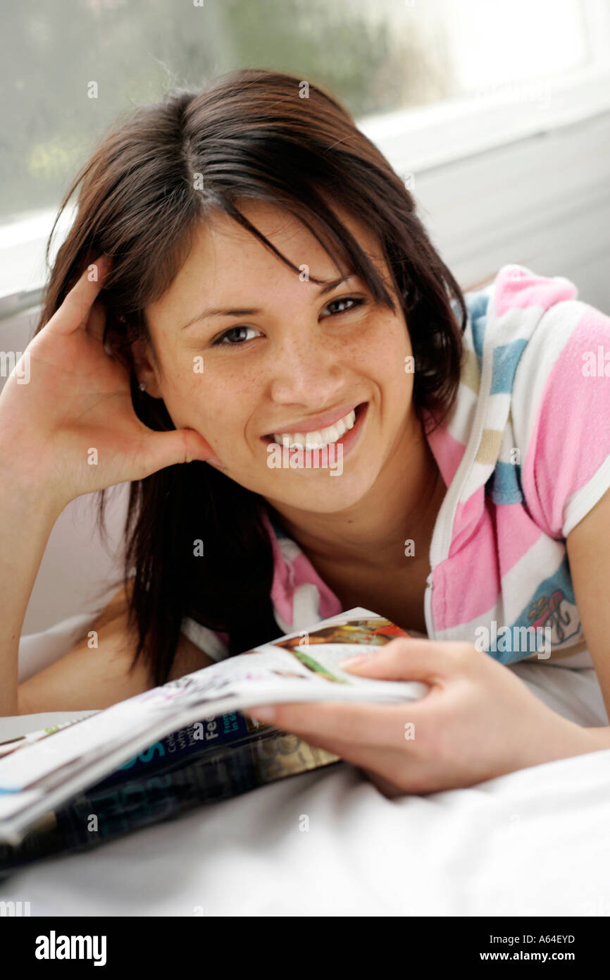 Young girl reading magazine Stock Photo - Alamy