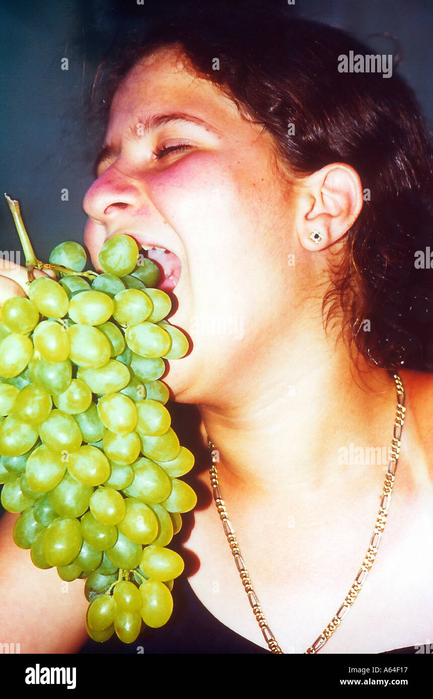 enjoy with a fresh grape on your mouth from lebanon Stock Photo - Alamy