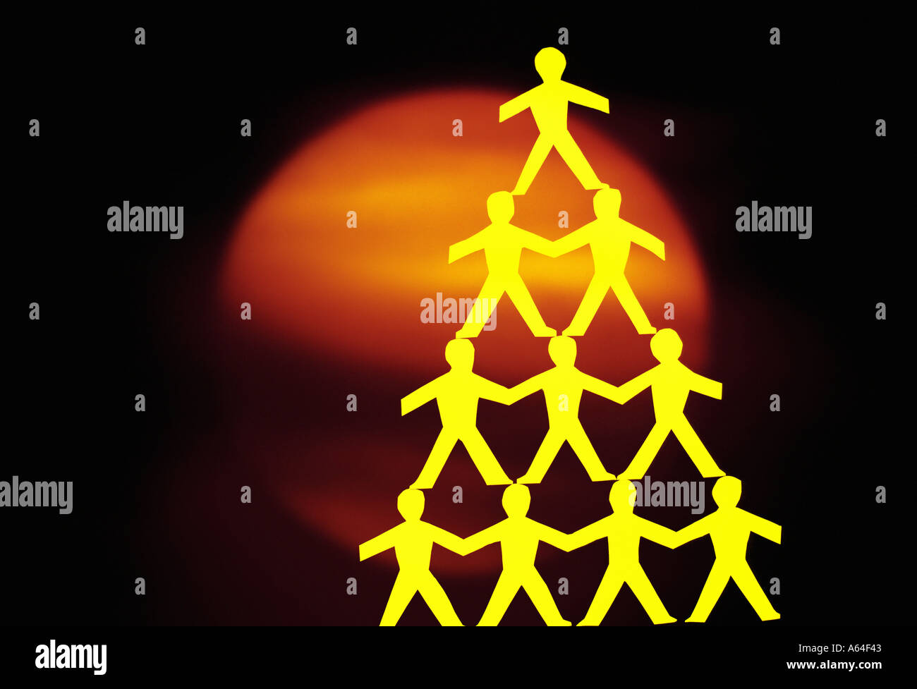 pyramid team of people working together in sunrise Stock Photo - Alamy