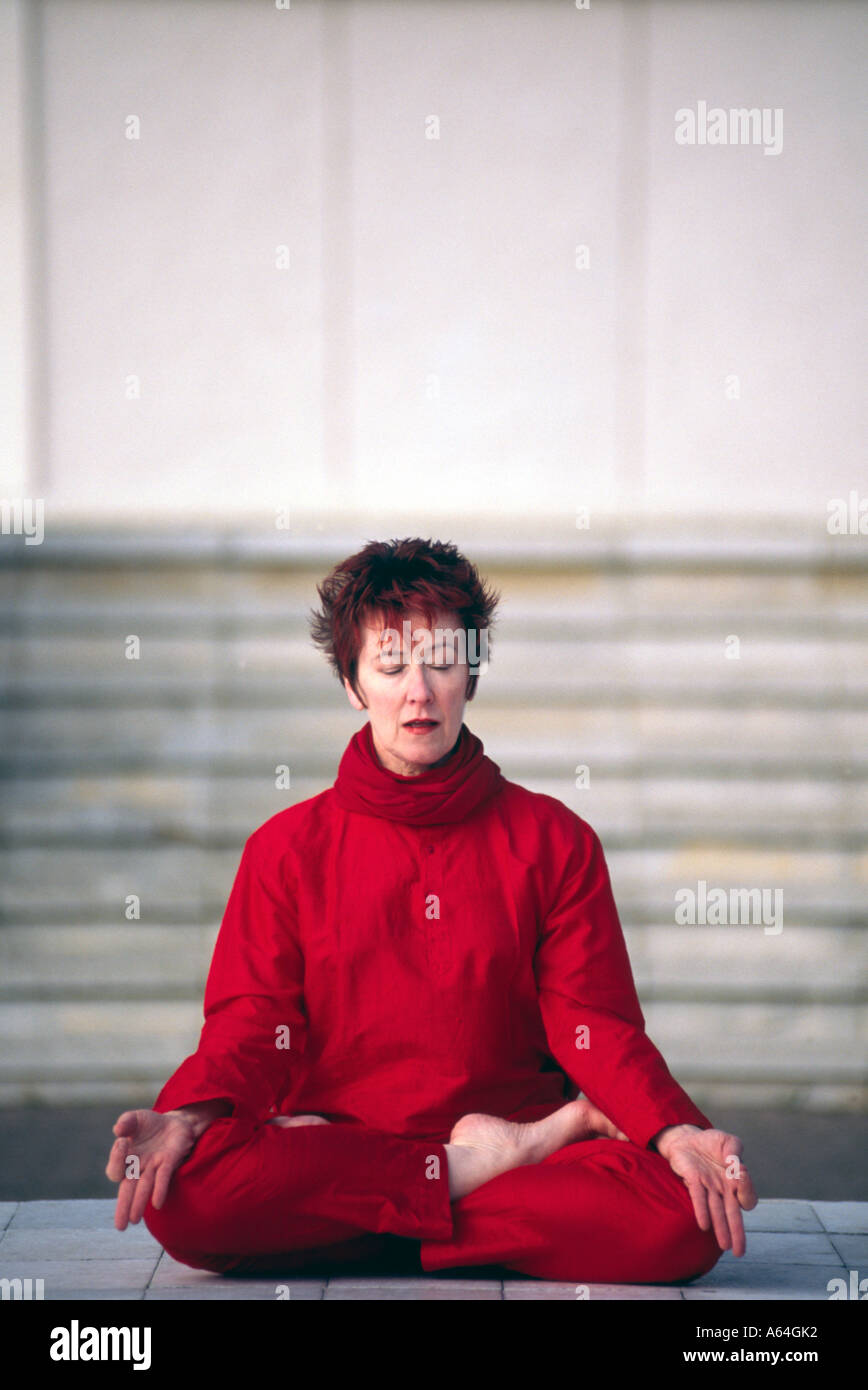 Carol Smith Yoga Teacher meditating in full lotus position in front of ...