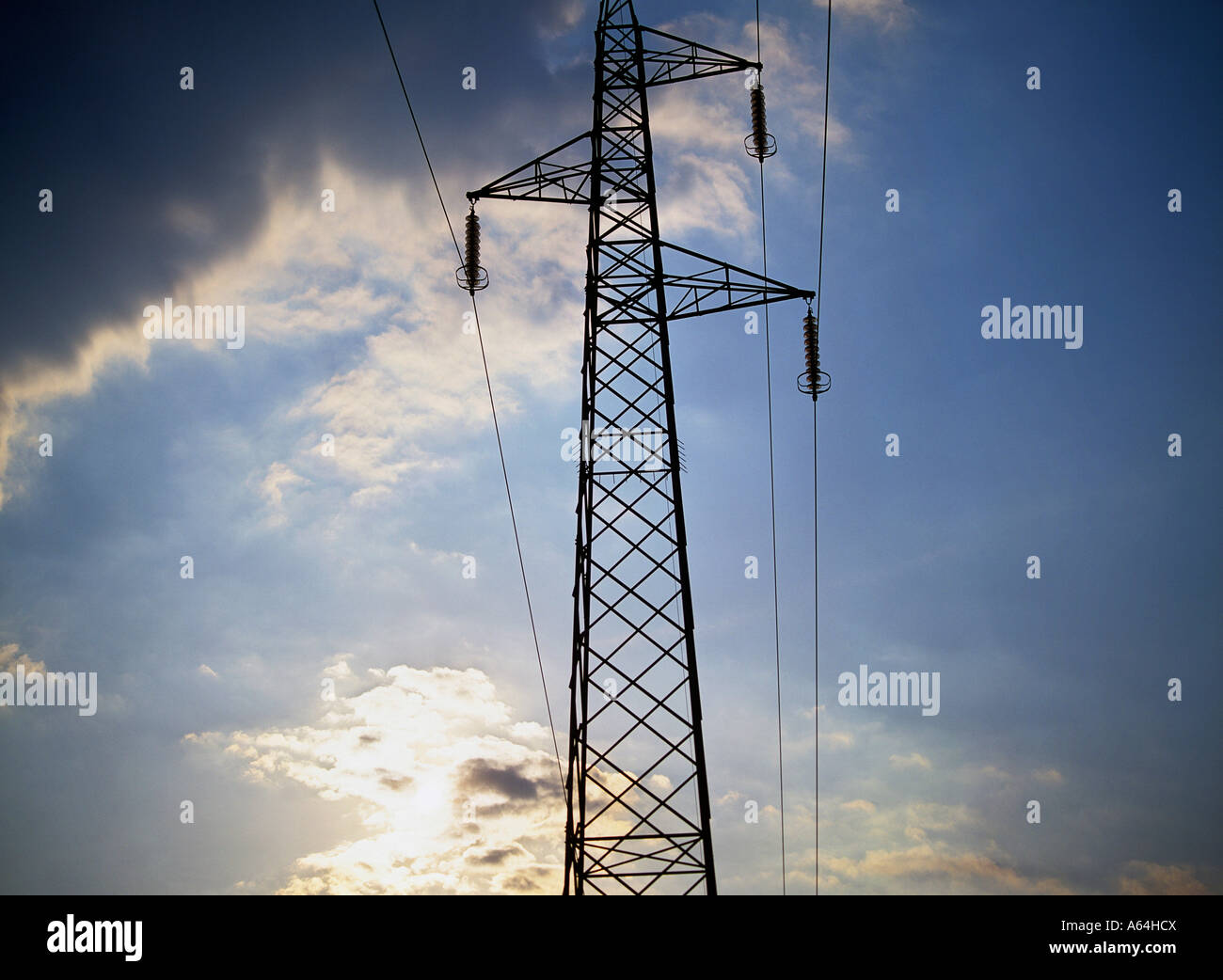 pylon and electricity power transmission lines at evening switzerland ...