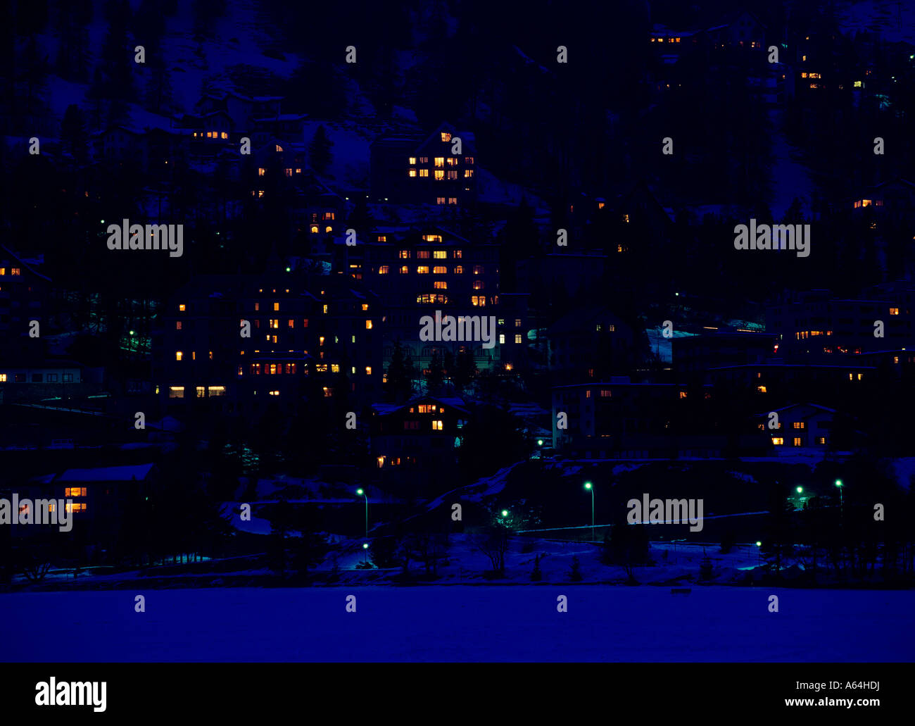 view from frozen saint moritz lake to resort of saint moritz at night ...