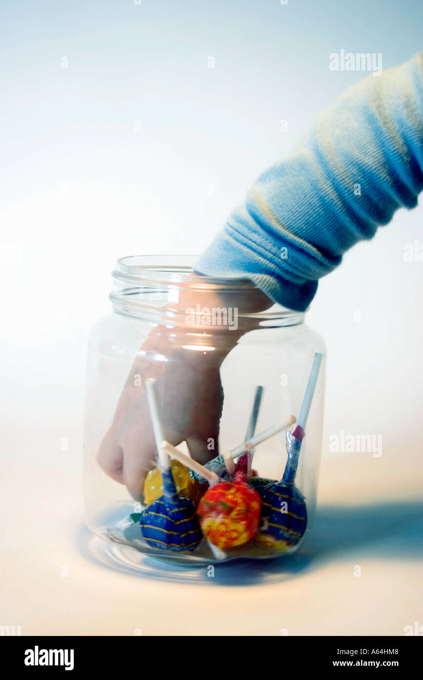 Hand taking sweets in sugar hi-res stock photography and images - Alamy