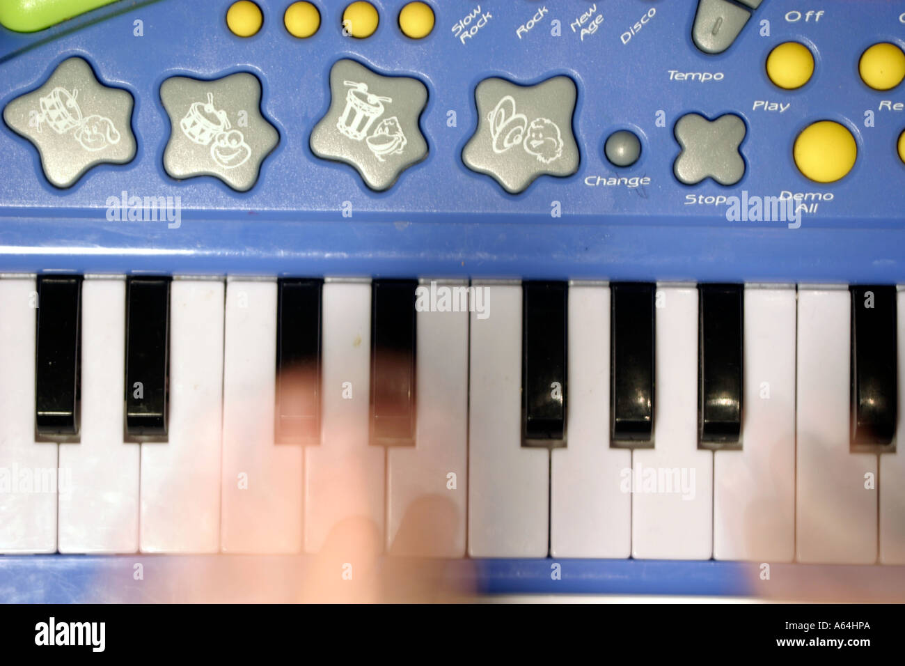 Childs fingers playing a toy keyboard Stock Photo - Alamy
