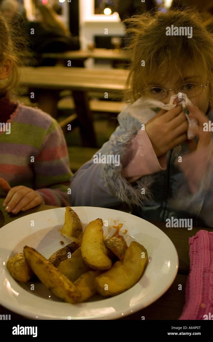Child eating potato chips Stock Photo - Alamy
