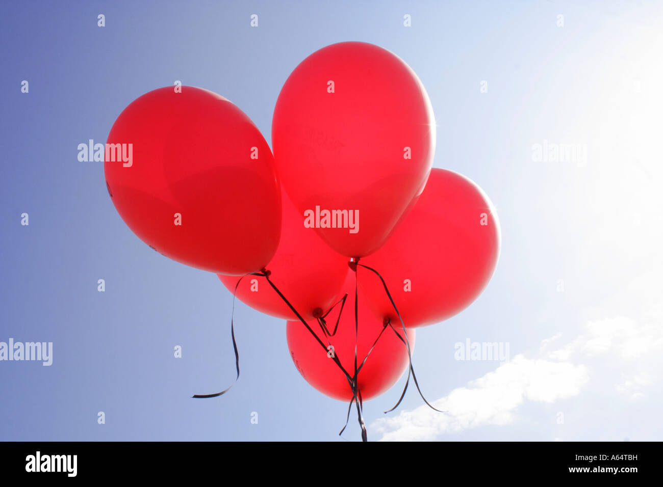 red balloons floating up into the sky Stock Photo - Alamy