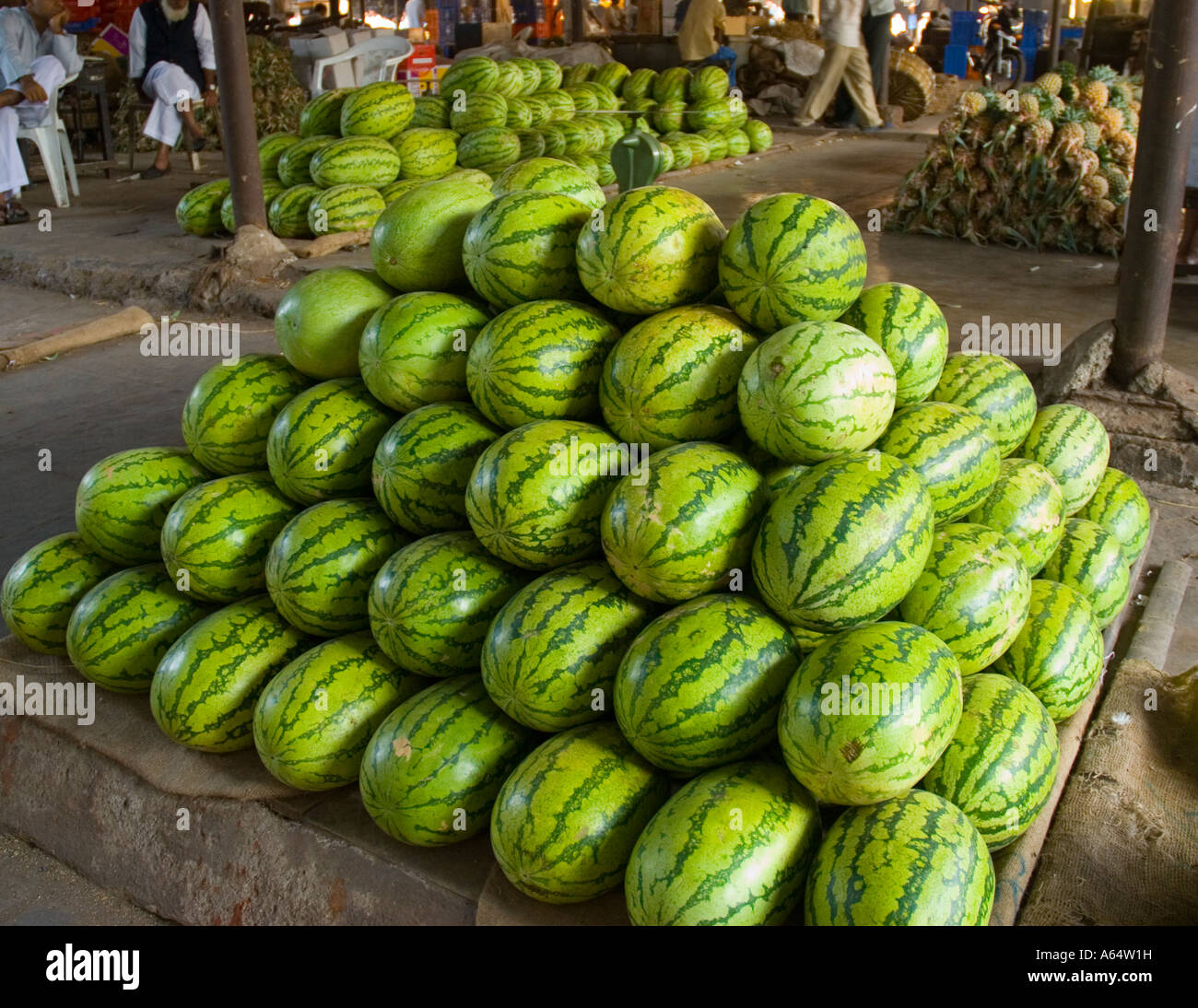 Water melons stacked on display on a market stall Stock Photo - Alamy