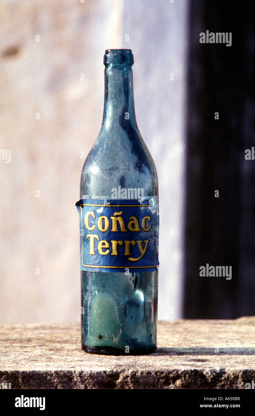 Empty cognac bottle on a wall, Formentera, Ballearic Isles Stock Photo ...