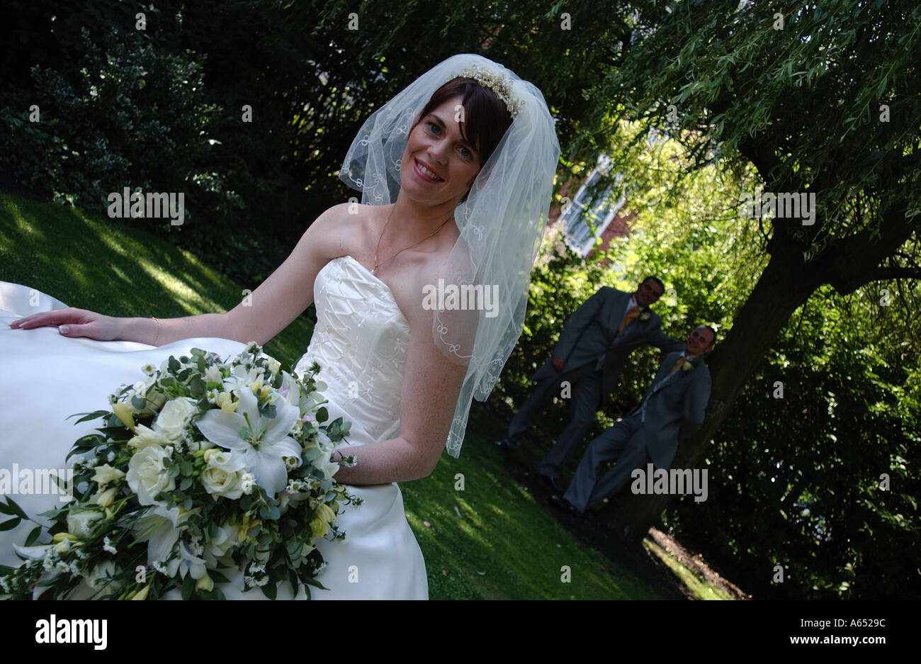 bride sitting down outside on wedding day Stock Photo - Alamy