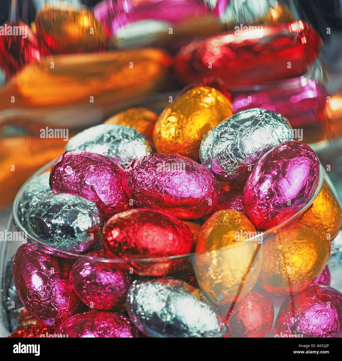 Mini chocolate eggs in a glass bowl Stock Photo - Alamy