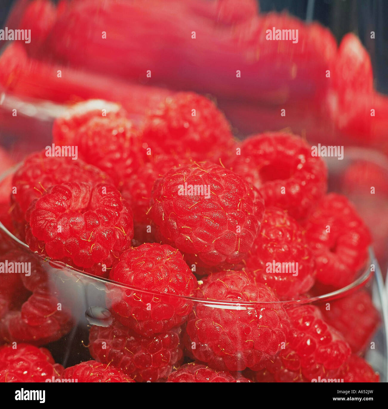 Raspberries in a glass bowl Stock Photo - Alamy