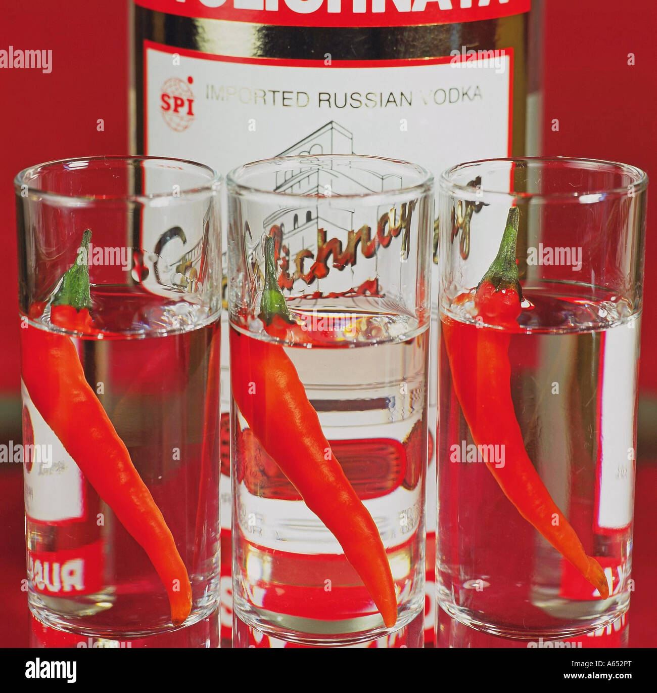Chilli vodka shots with whole birds eye chillies Stock Photo - Alamy