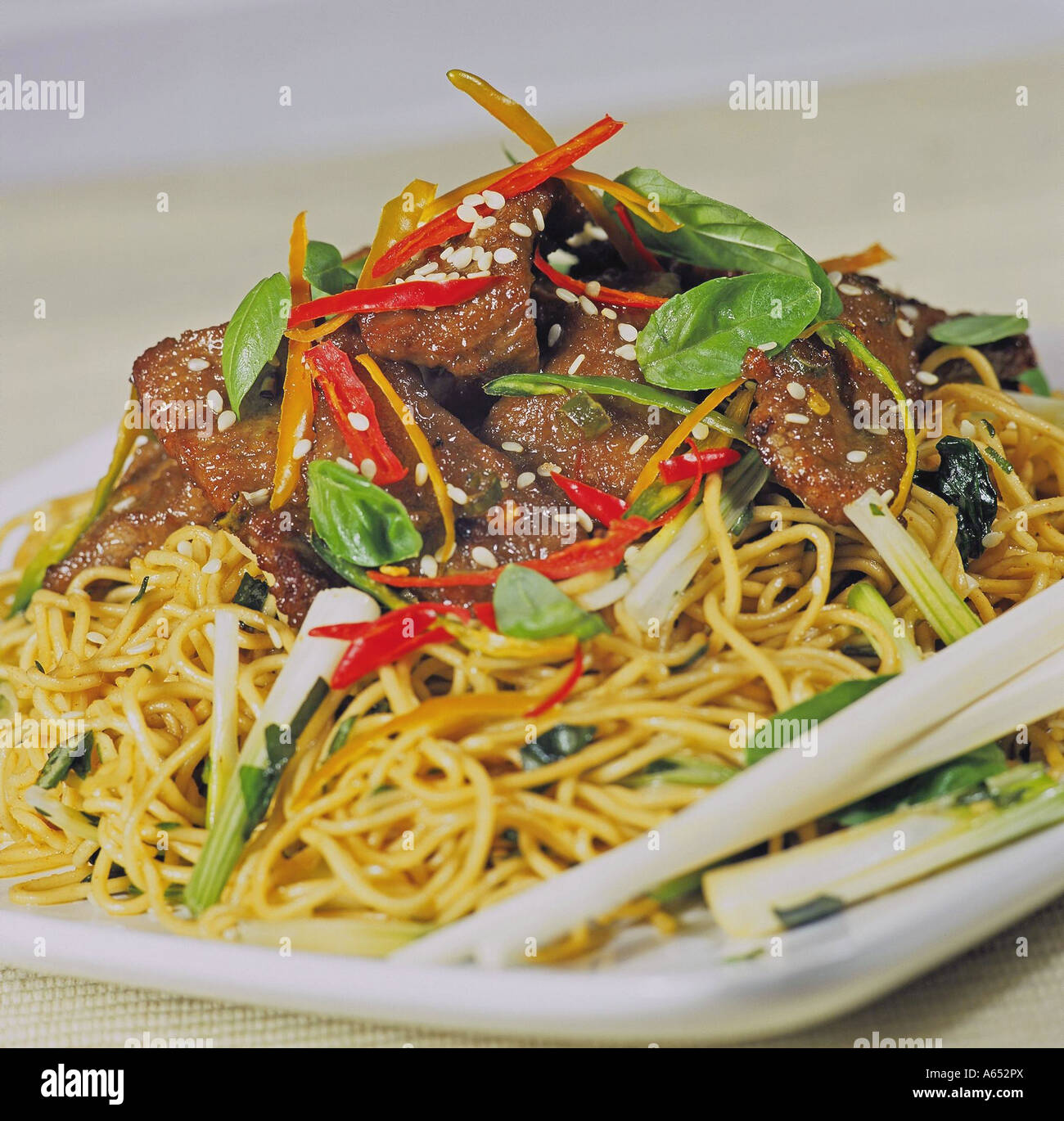 Egg thread noodles with Korean-style chilli beef Stock Photo - Alamy