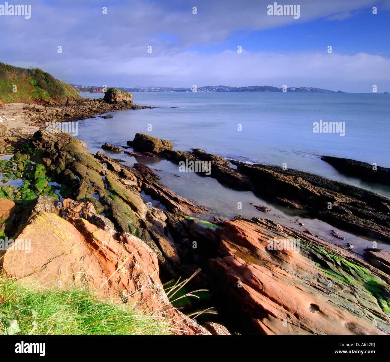 Early morning light at Shell Cove near Paignton South Devon showing the ...