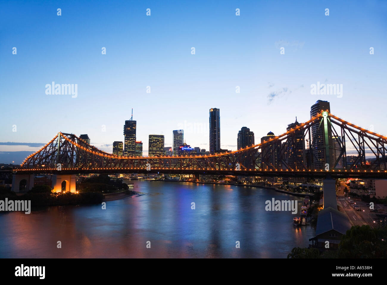 The Brisbane city skyline at dusk with the Story Bridge illuminated ...