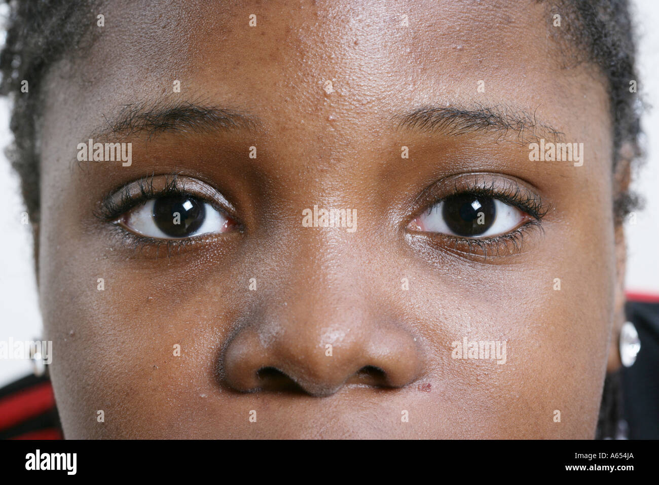 Young woman's face. Part of a series of eye movement, the 9 positions ...