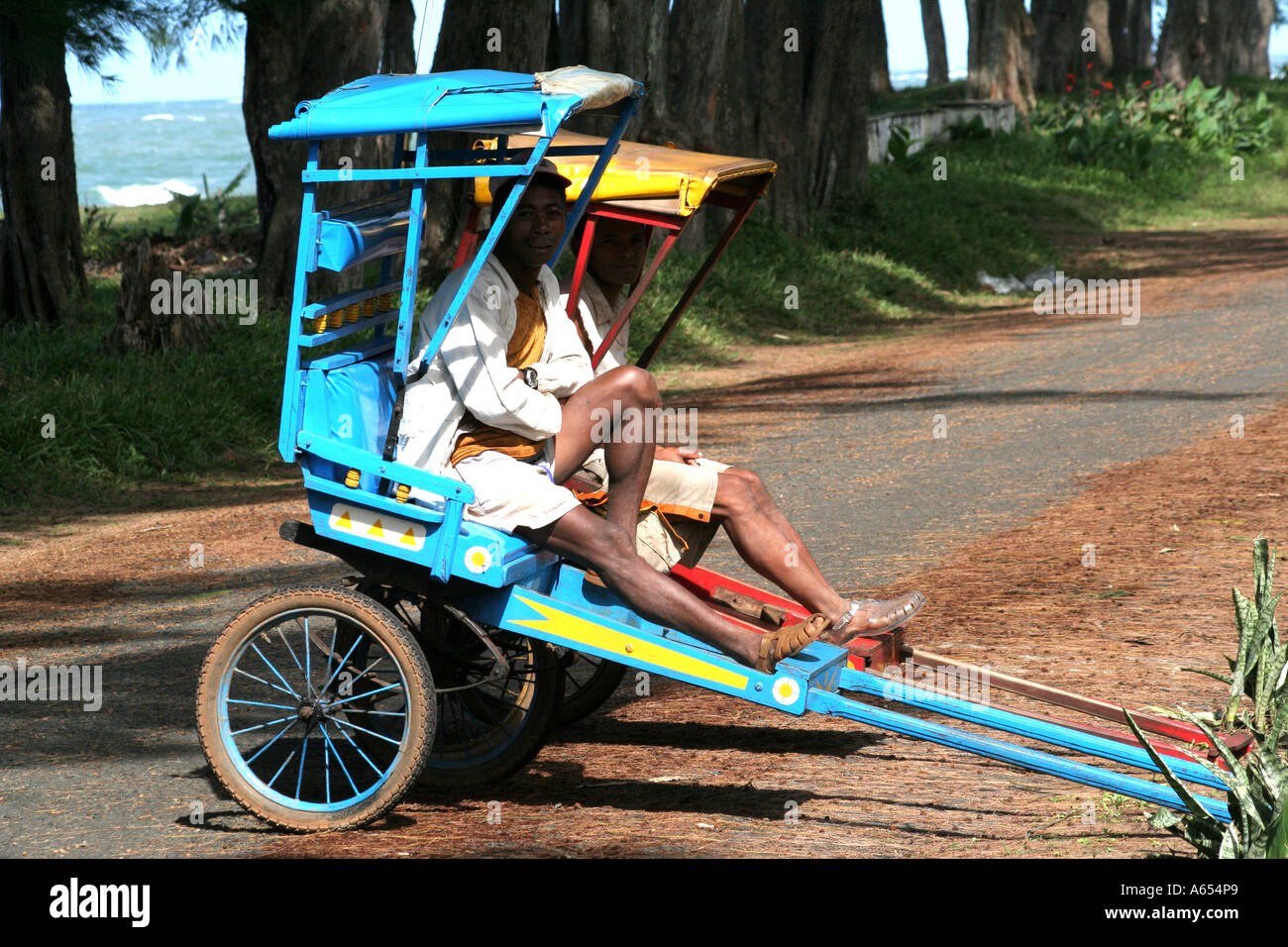 Manakara, Madagascar, Pousse Pousse and drivers waiting for customers ...