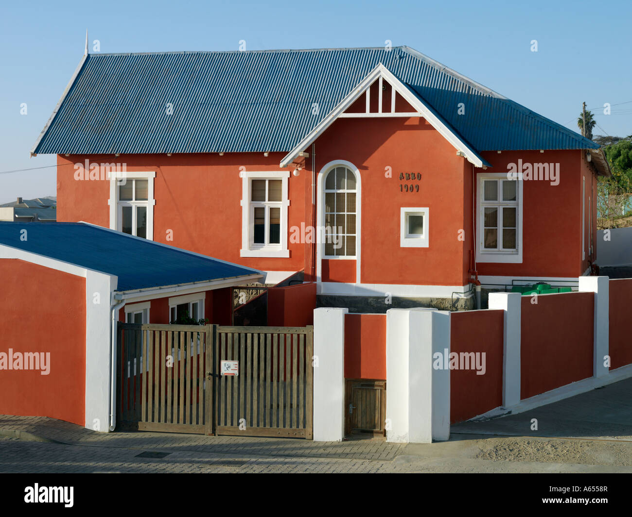 A well preserved brightly coloured German colonial house in Luderitz ...