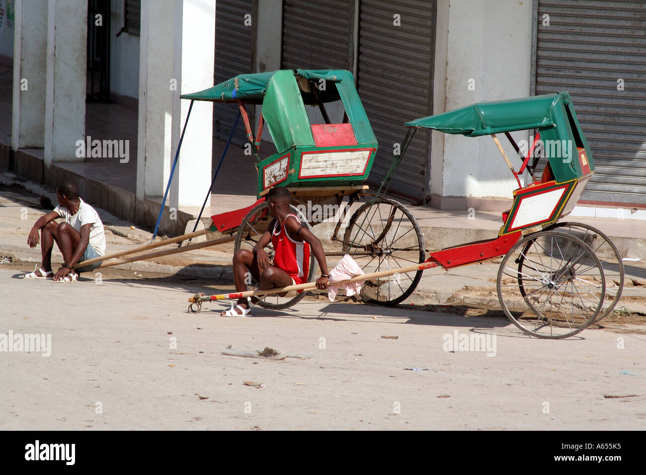 Rickshaw driver sitting in cab hi-res stock photography and images - Alamy