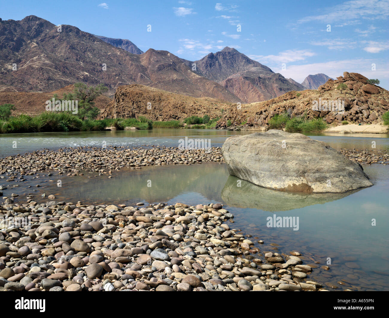 The beautiful scenery bounding the Kunene River at Marienfluss situated ...