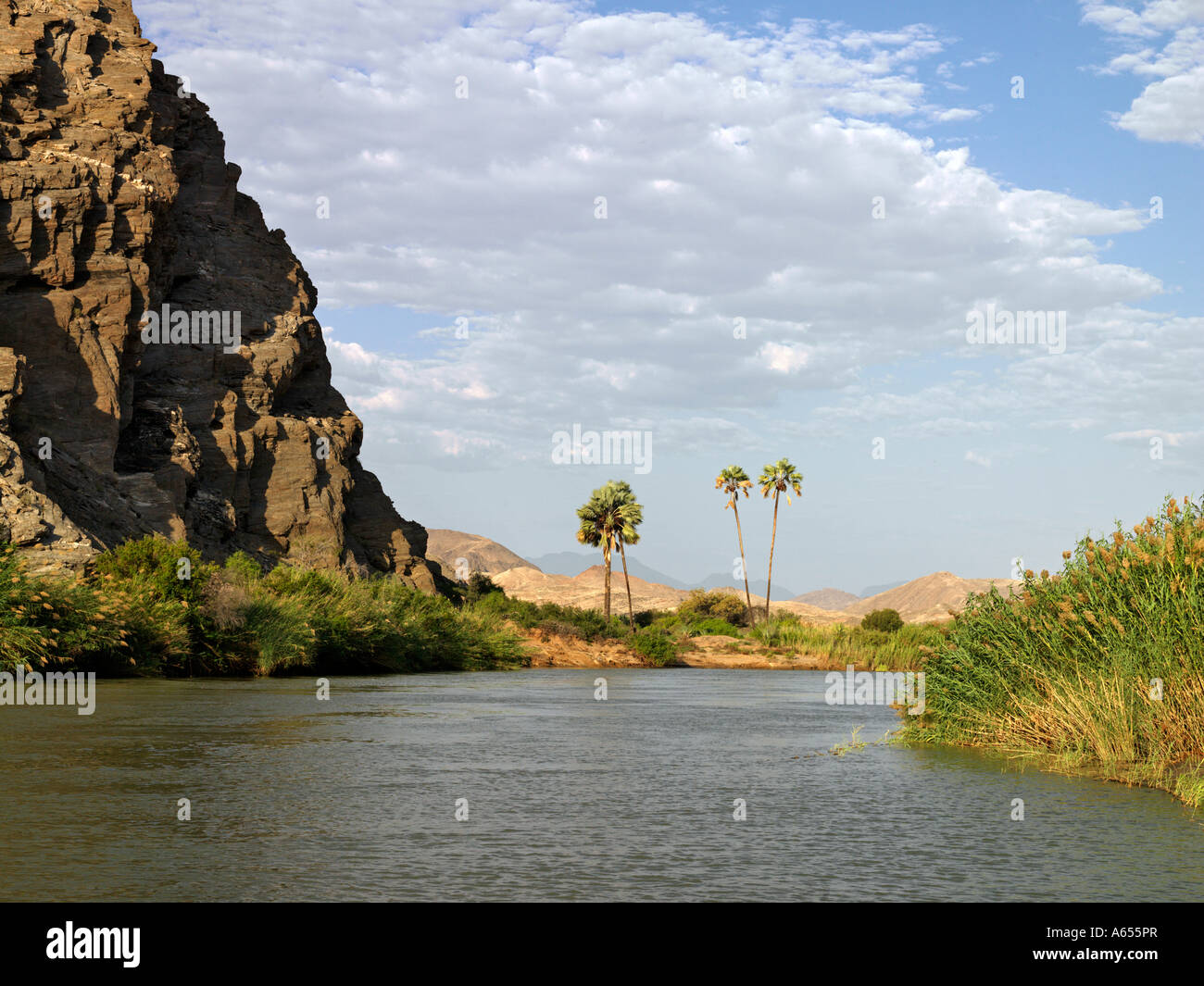 The beautiful scenery bounding the Kunene River at Serra Cafema ...