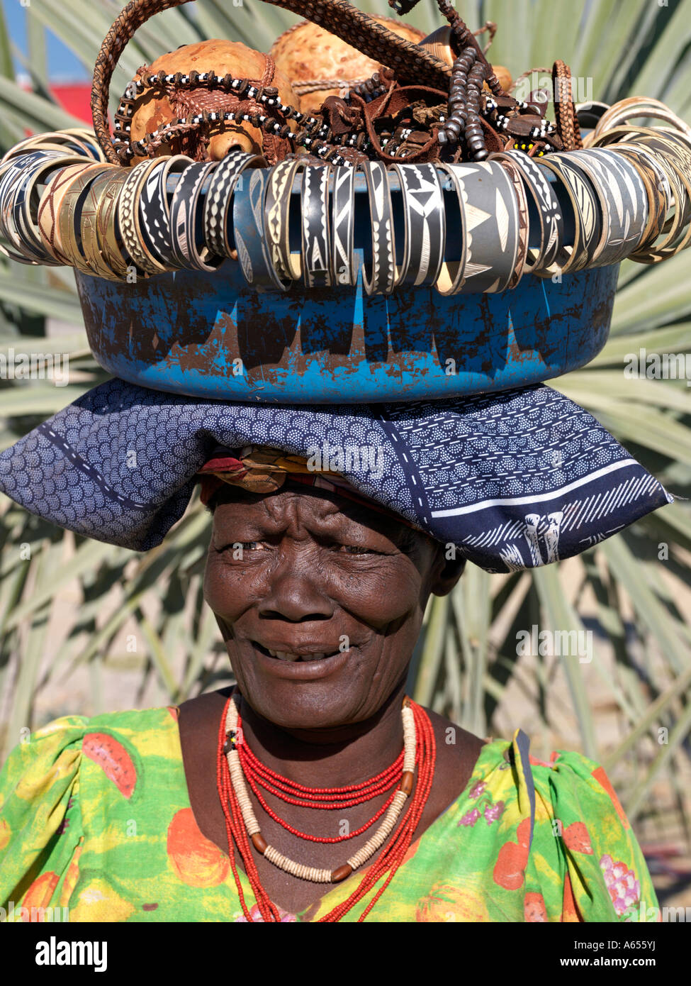 A Himba street vendor at Opuwo who sells Himba Jewellery arts and ...