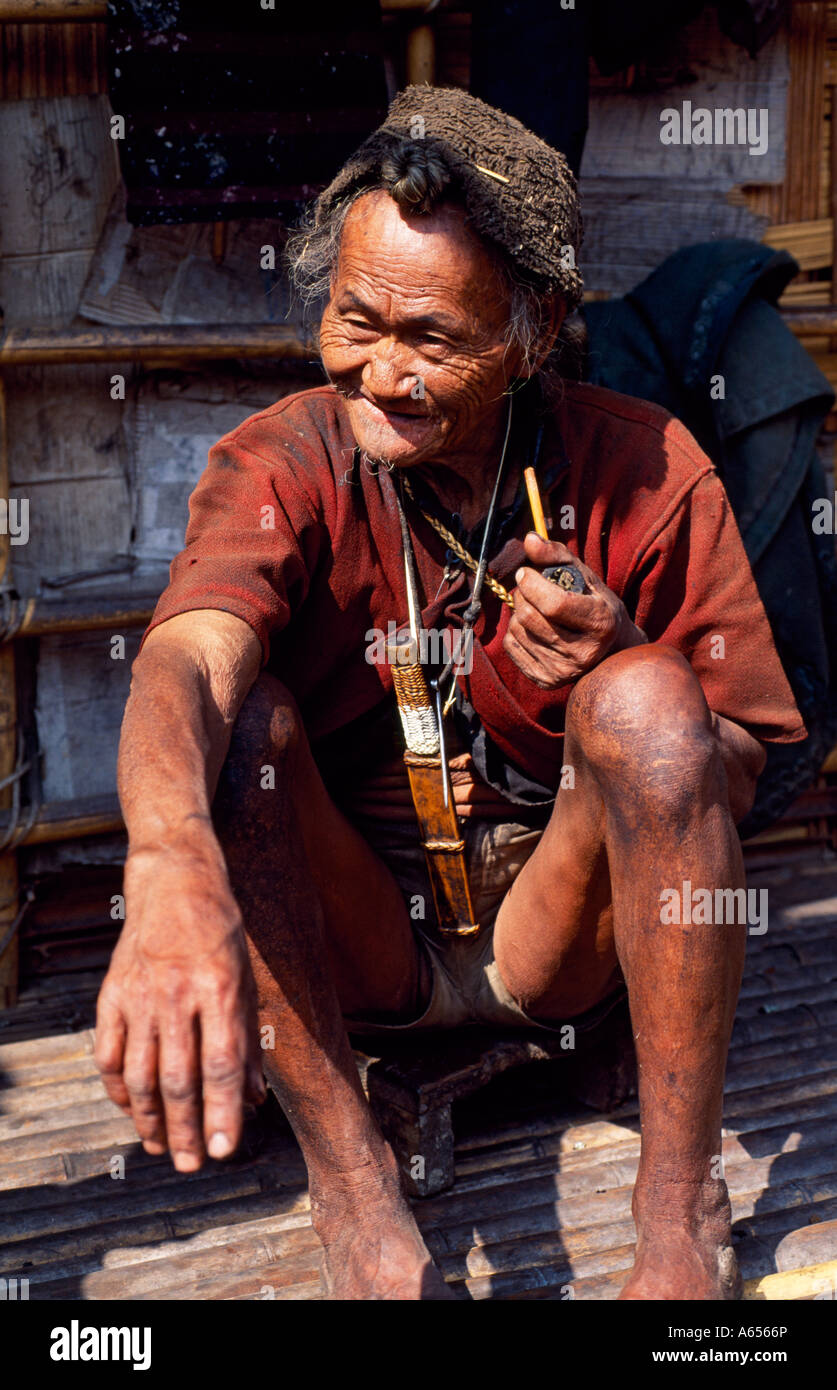 Apatani tribal elder with distinctive top hair knot in the village of ...