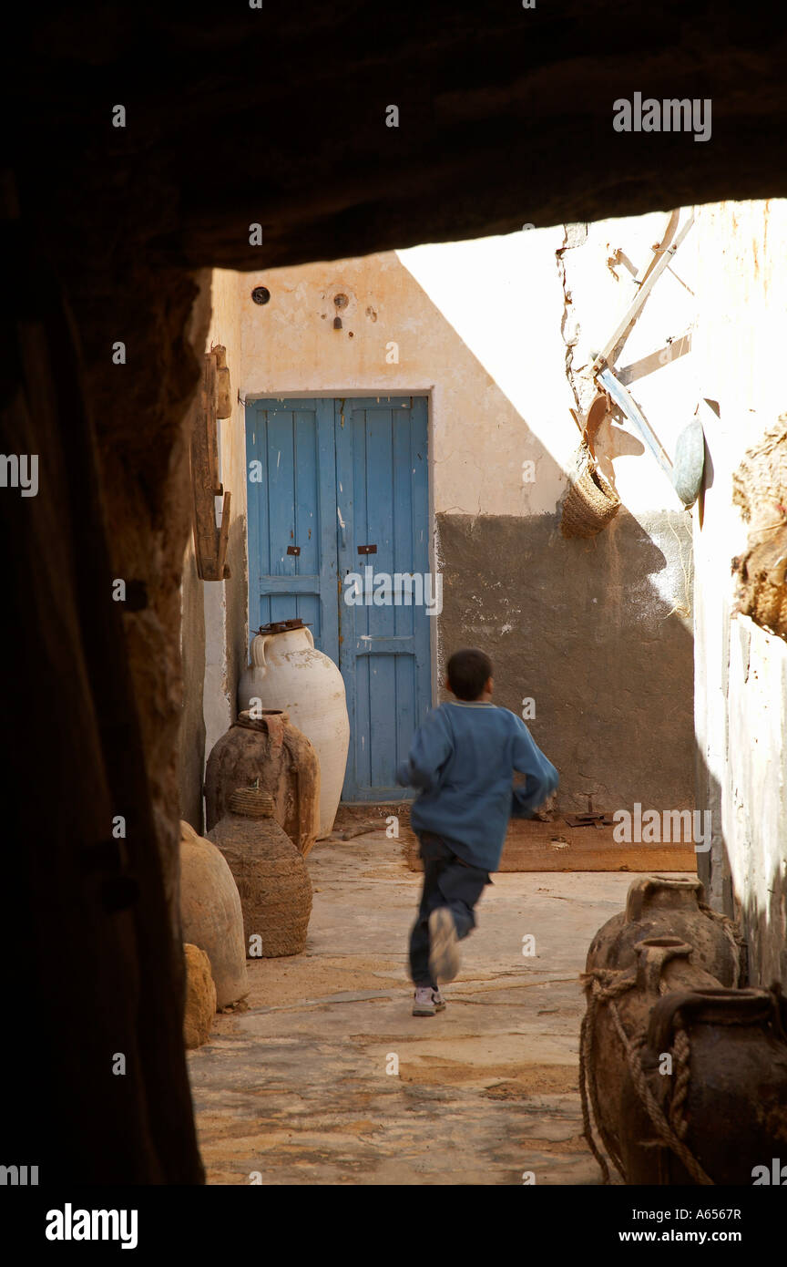 A young boy runs out of one of the rooms in the privately run museum in ...
