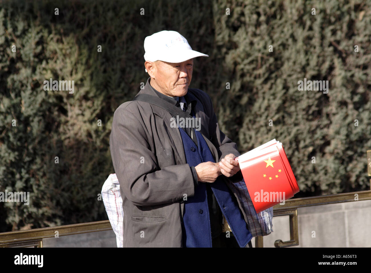 Tiananmen Square, Beijing, China, old man selling patriotic flags Stock ...