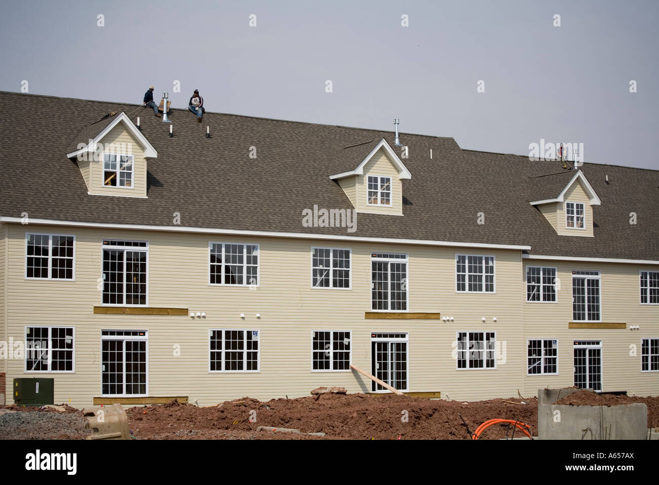 Immigrant Construction Worker Working on the Roof Stock Photo - Alamy