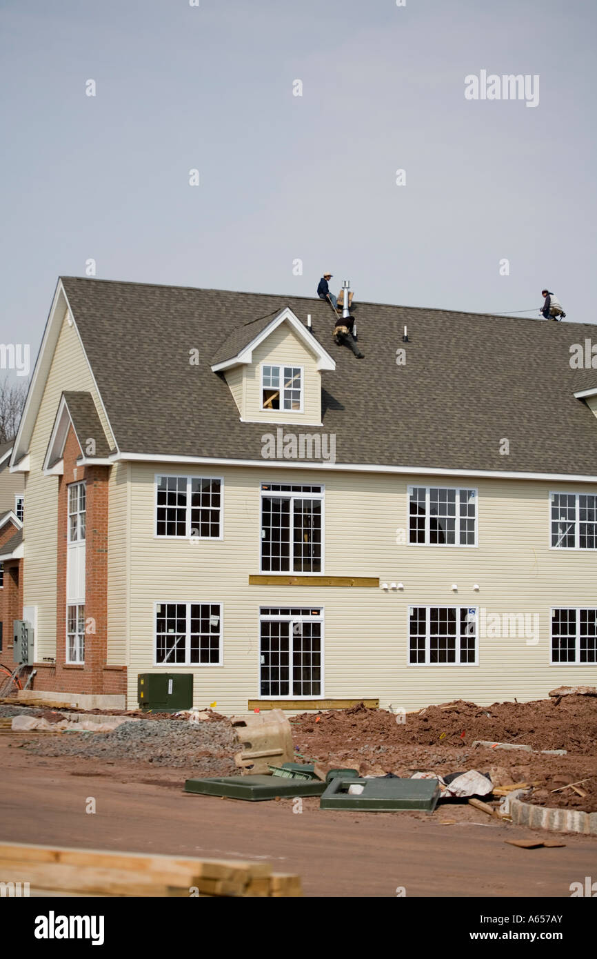 Immigrant Construction Worker Working on the Roof Stock Photo - Alamy