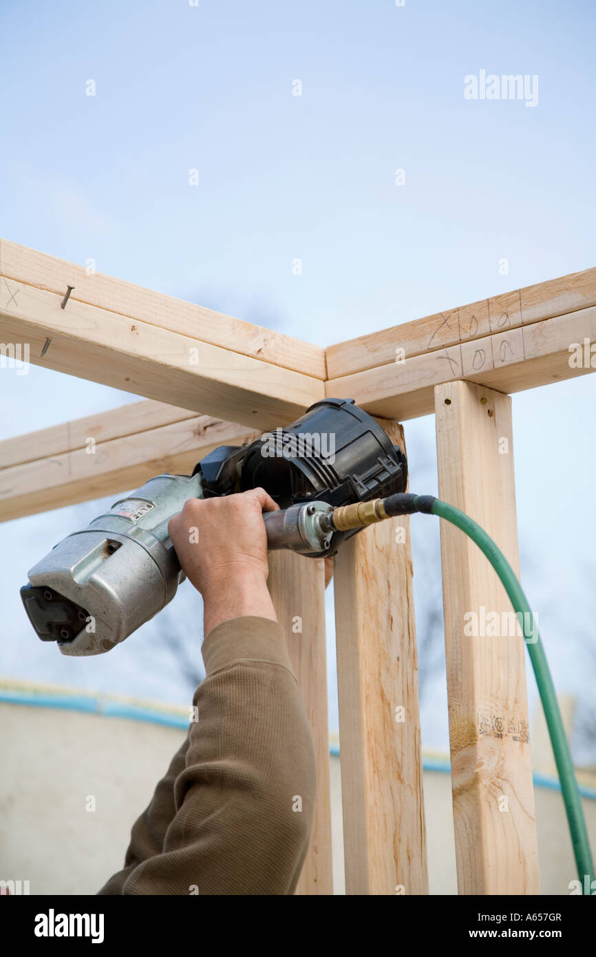 Immigrant Construction Worker Framing the House Stock Photo - Alamy
