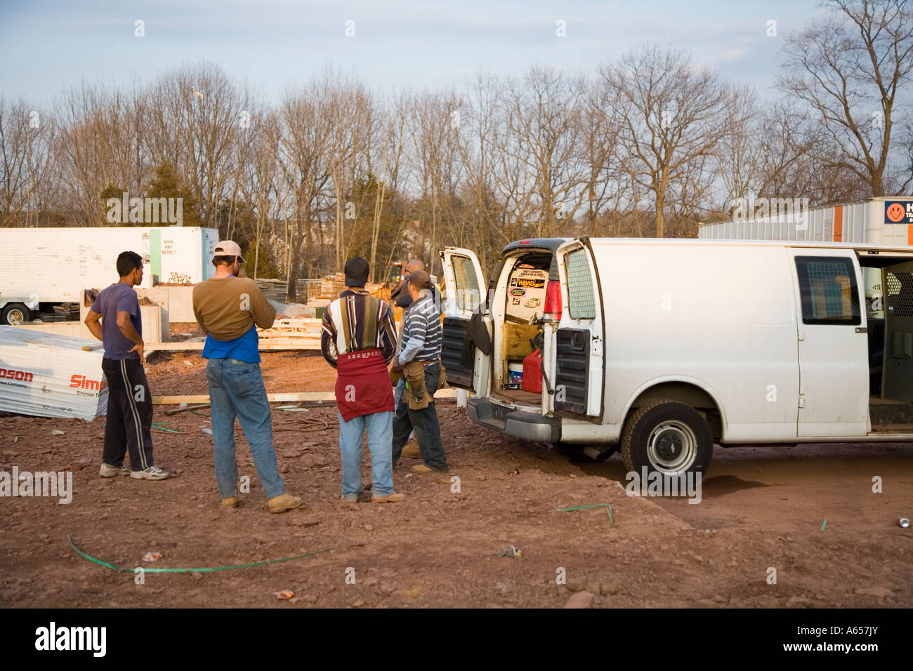 Immigrant Construction Worker Finishing Work Stock Photo - Alamy