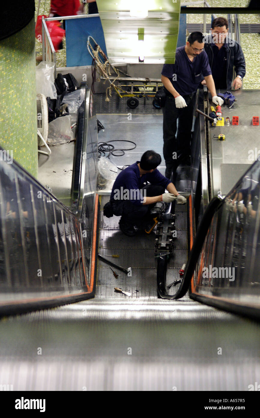 Repairing an escalator in the Wanchai subway station, Hong Kong Stock ...