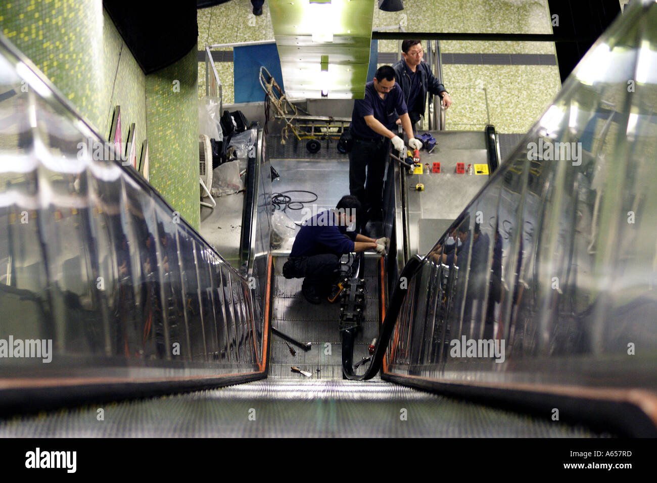 Repairing an escalator in the Wanchai subway station, Hong Kong SAR ...