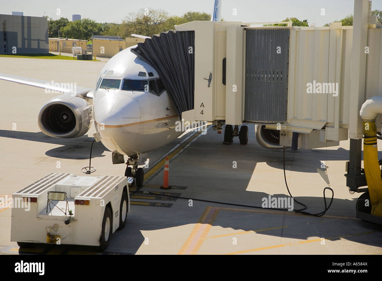 Jet being serviced at the gate Stock Photo - Alamy