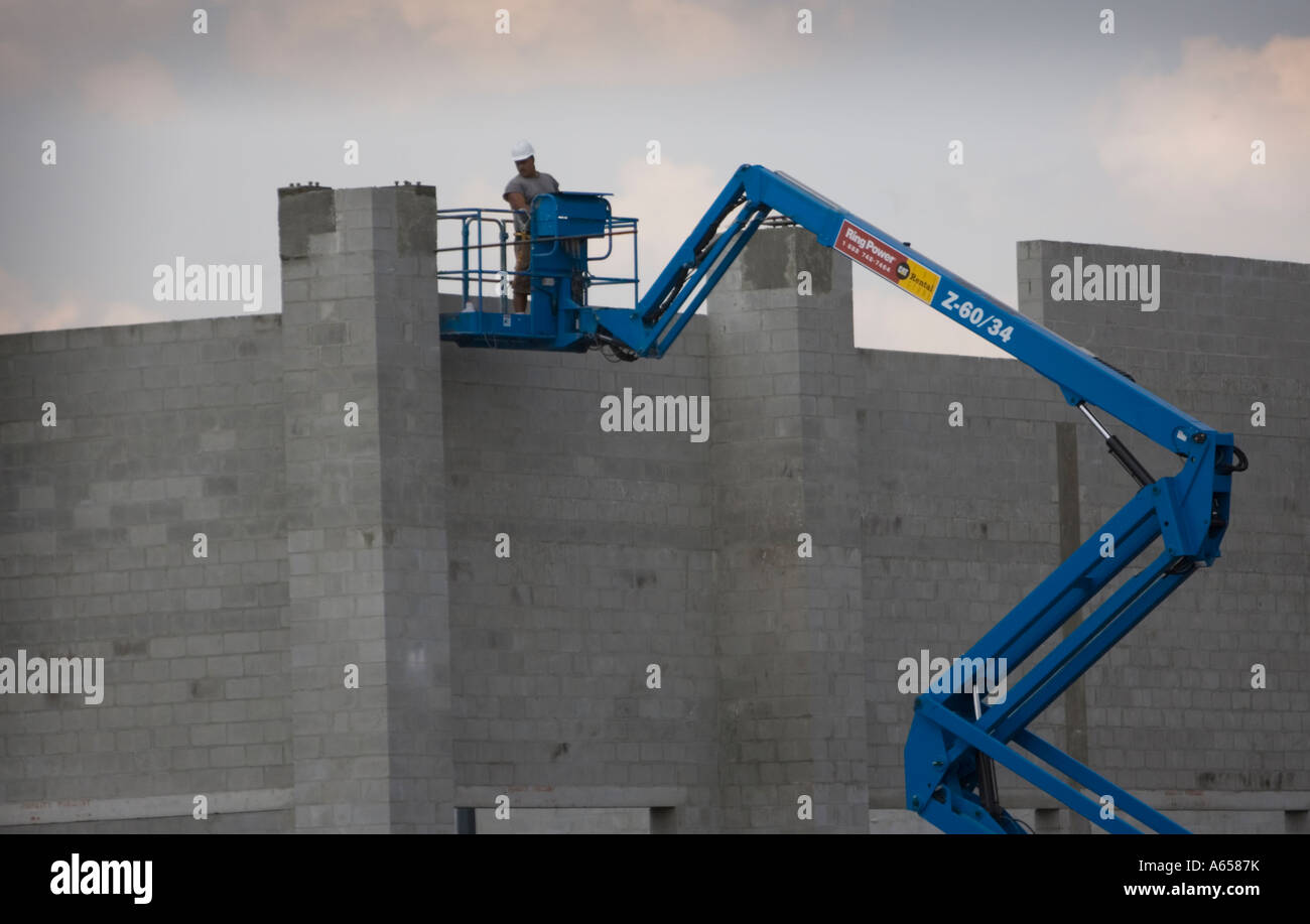 Construction worker on a cherry picker Stock Photo - Alamy