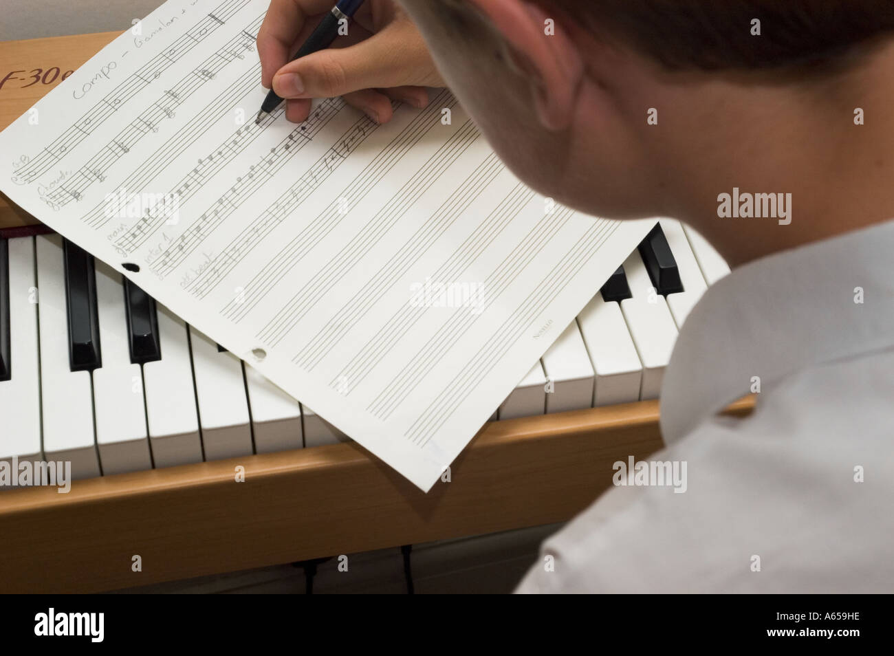 Learning to play piano Stock Photo - Alamy