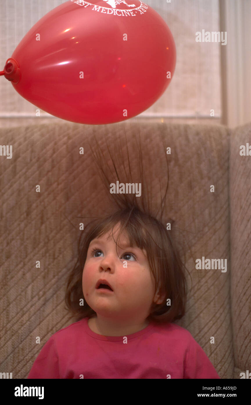 Static balloon on hair hi-res stock photography and images - Alamy