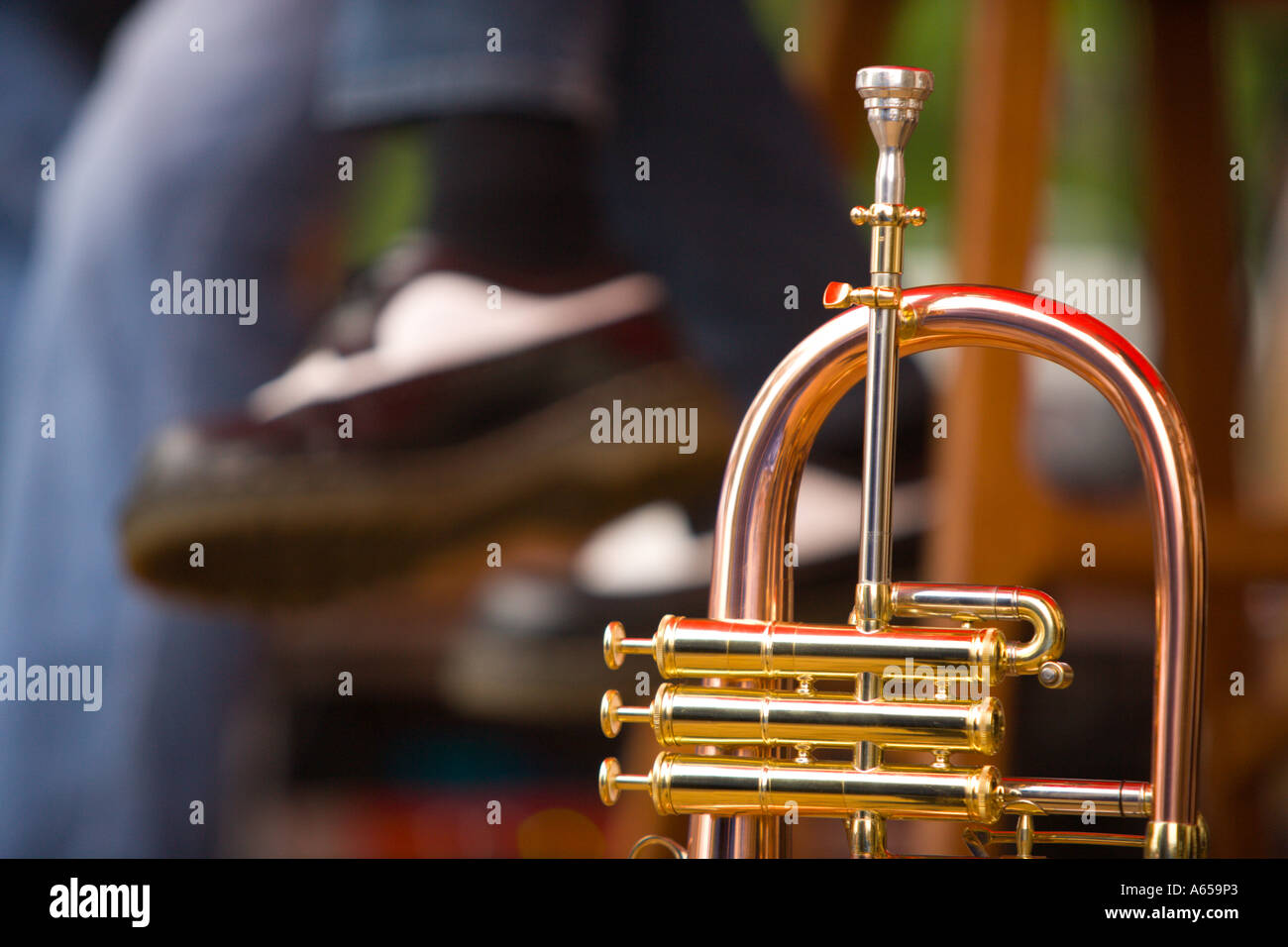 Trumpet with musician's foot Stock Photo - Alamy